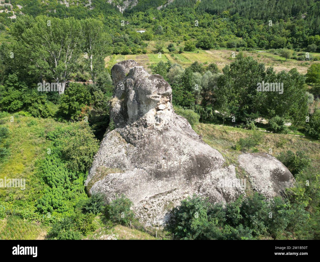 A huge rock formation in the forest Stock Photo - Alamy