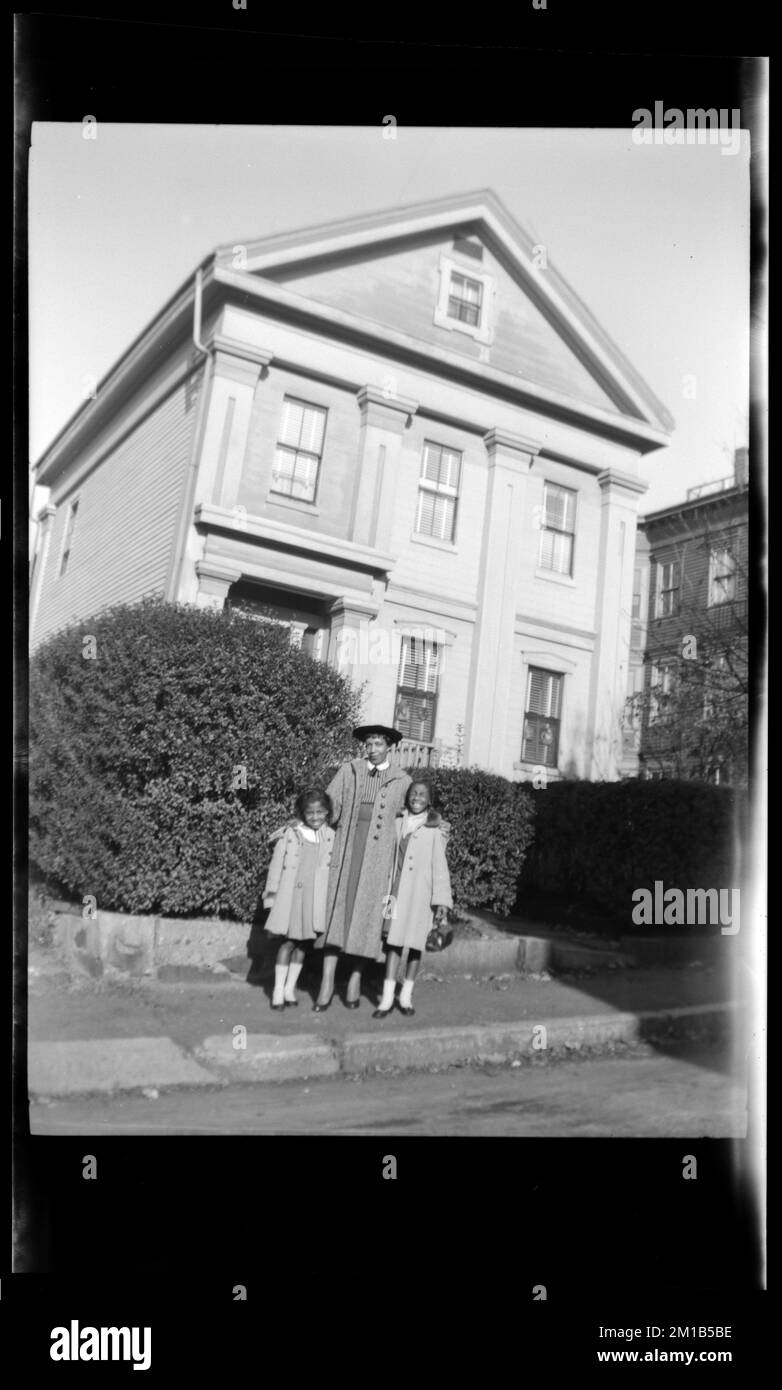 Vivian and two girls pose in front of a house and shrubs , Girls ...