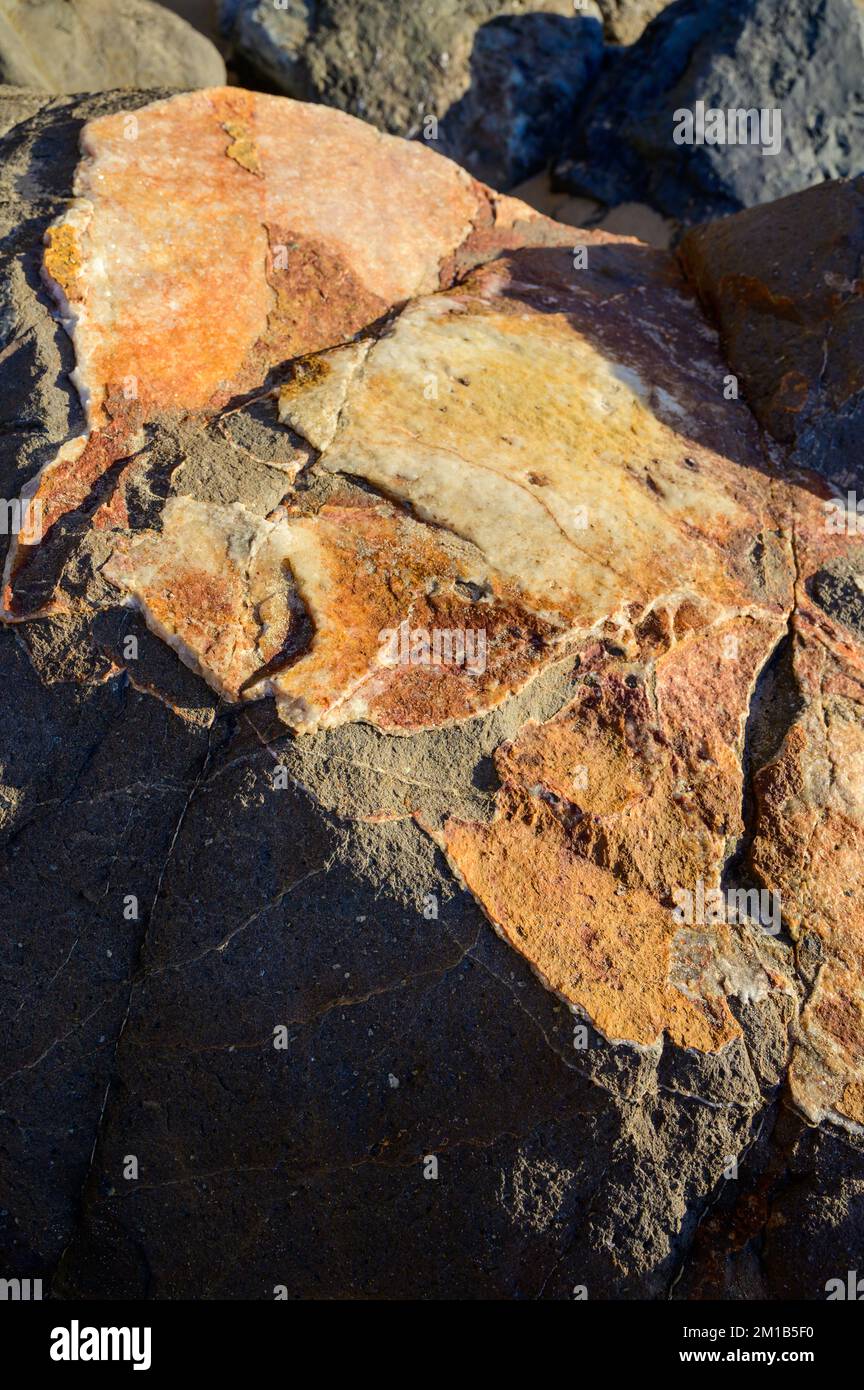 Geological formation of colorful stones with different layers, yellow ...