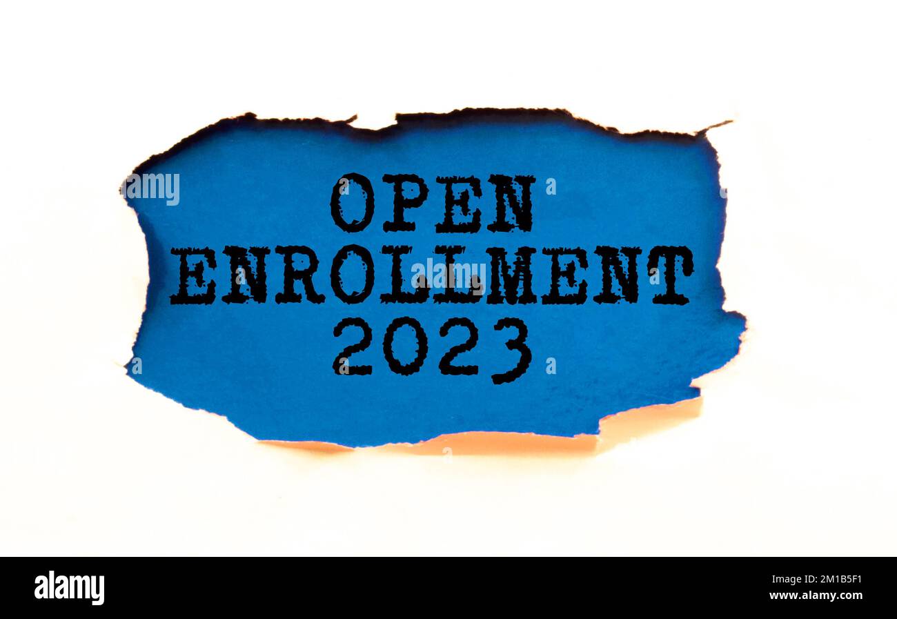 Open Enrollment. Text and a man's hand holding a black marker on a ...