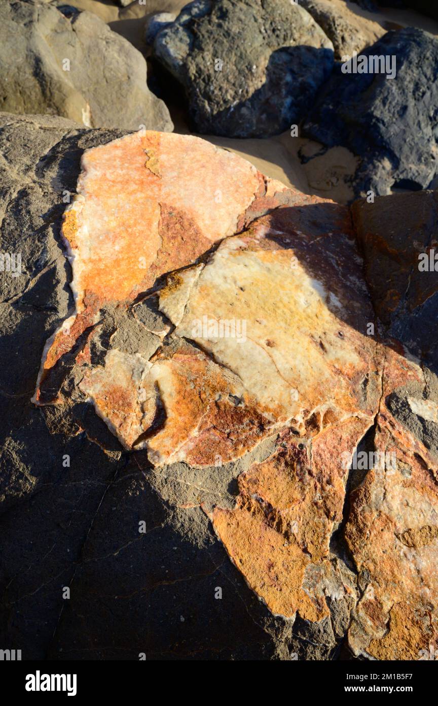 Geological formation of colorful stones with different layers, yellow ...
