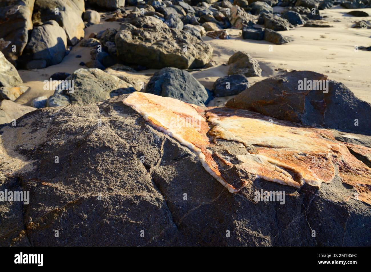 Geological formation of colorful stones with different layers, yellow ...
