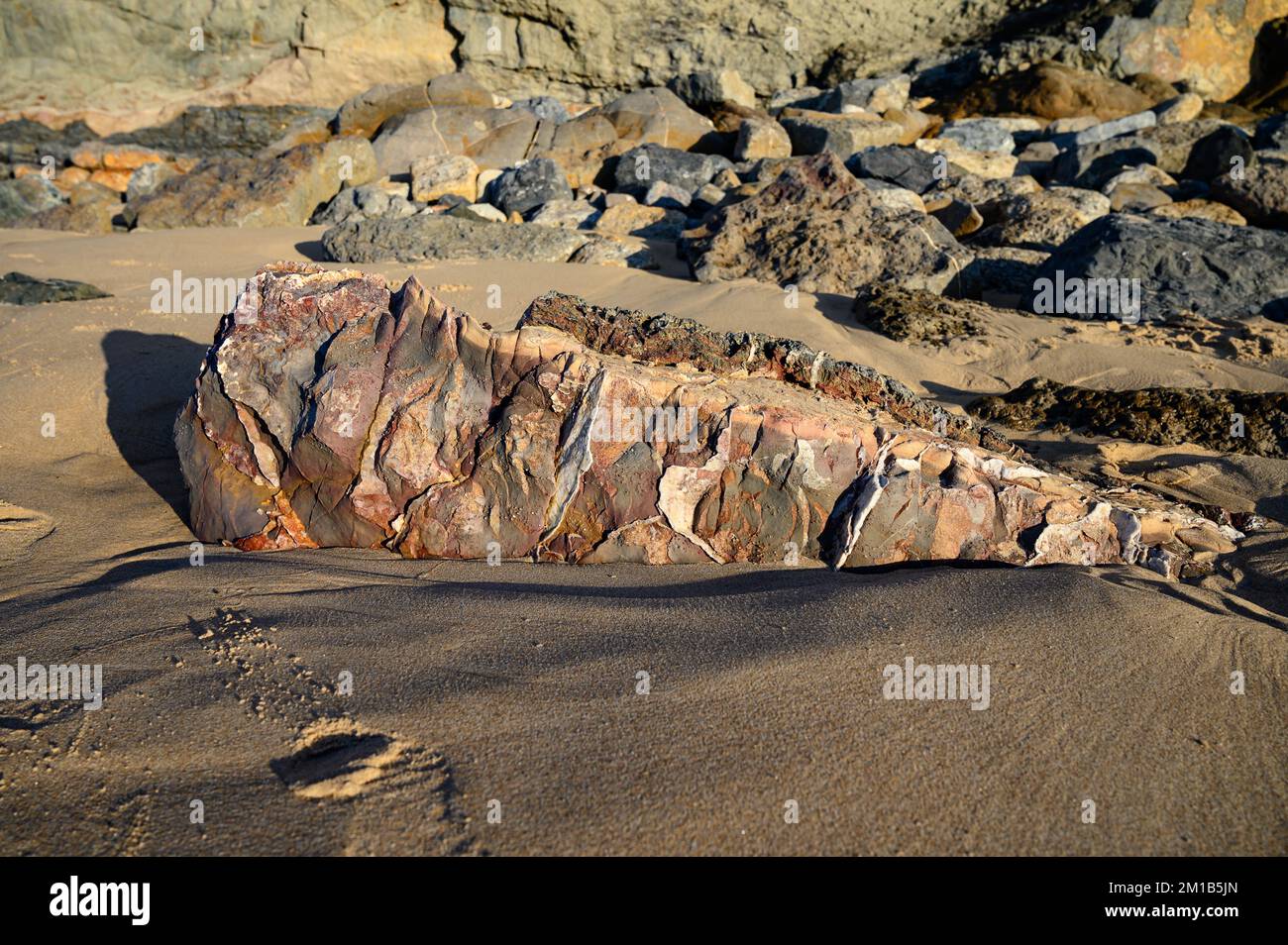 Geological formation of colorful stones with different layers, yellow ...