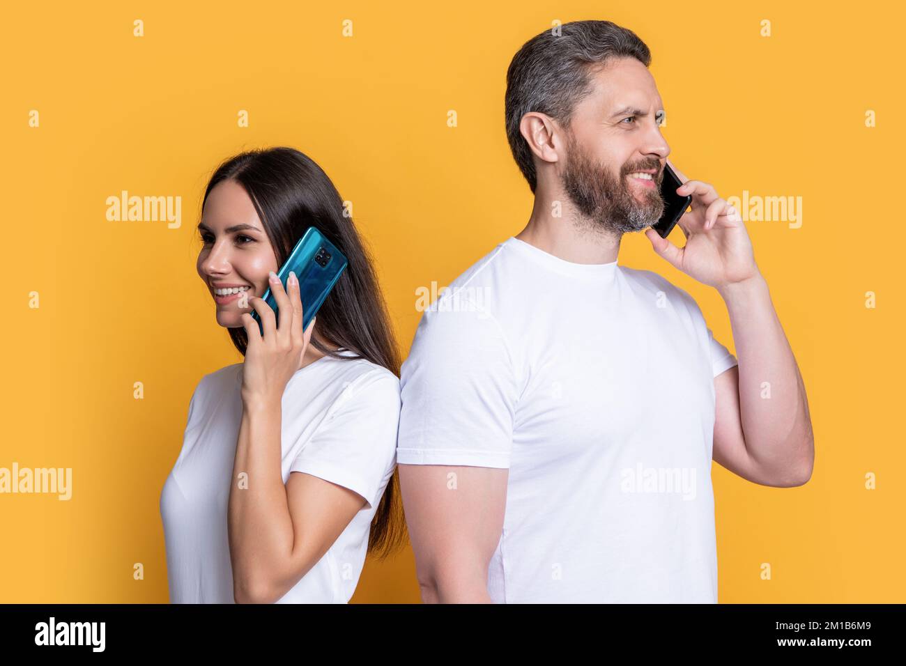 Mobile phone conversation of positive couple. Mobile communication of ...