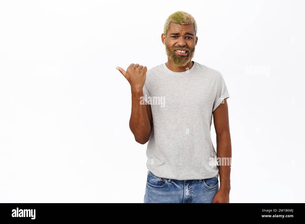 Dislike. Disappointed african american guy with yellow modern hairstyle ...