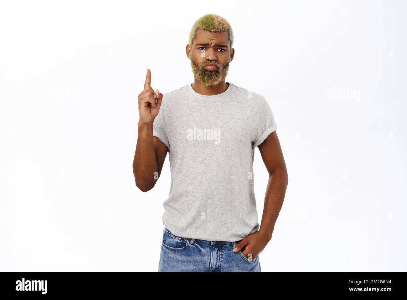 Sad handsome hipster guy, adult black man with yellow beard, pointing ...