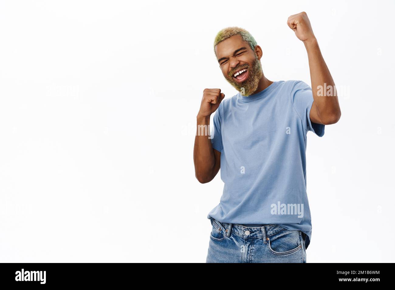Champion. Happy adult man celebrating success, fist pump and scream yes ...