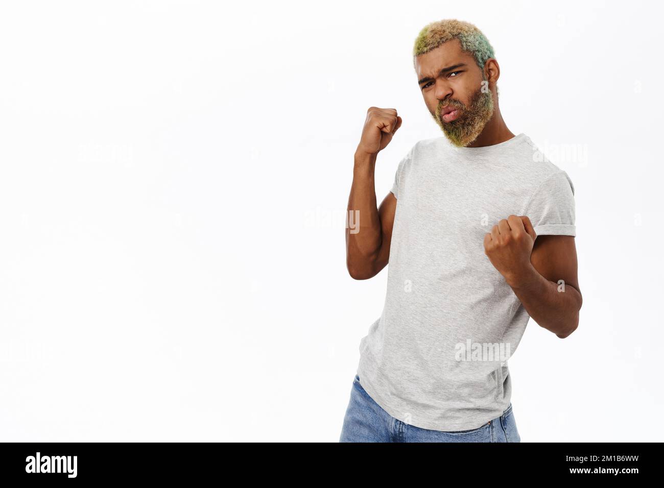 Winning people. Happy african american guy dancing and rejoicing ...