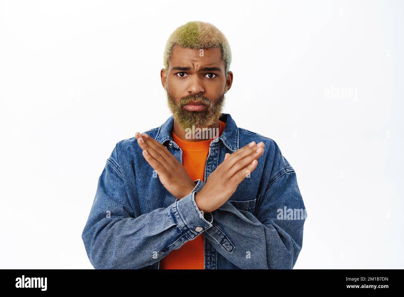 Close up of concerned Black man, shows cross sign, stop gesture, asking ...