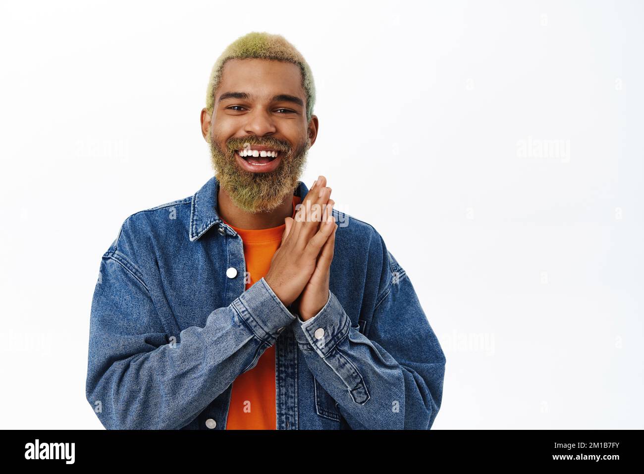 Close up of happy black man clap hands, applause and laughs, stands ...