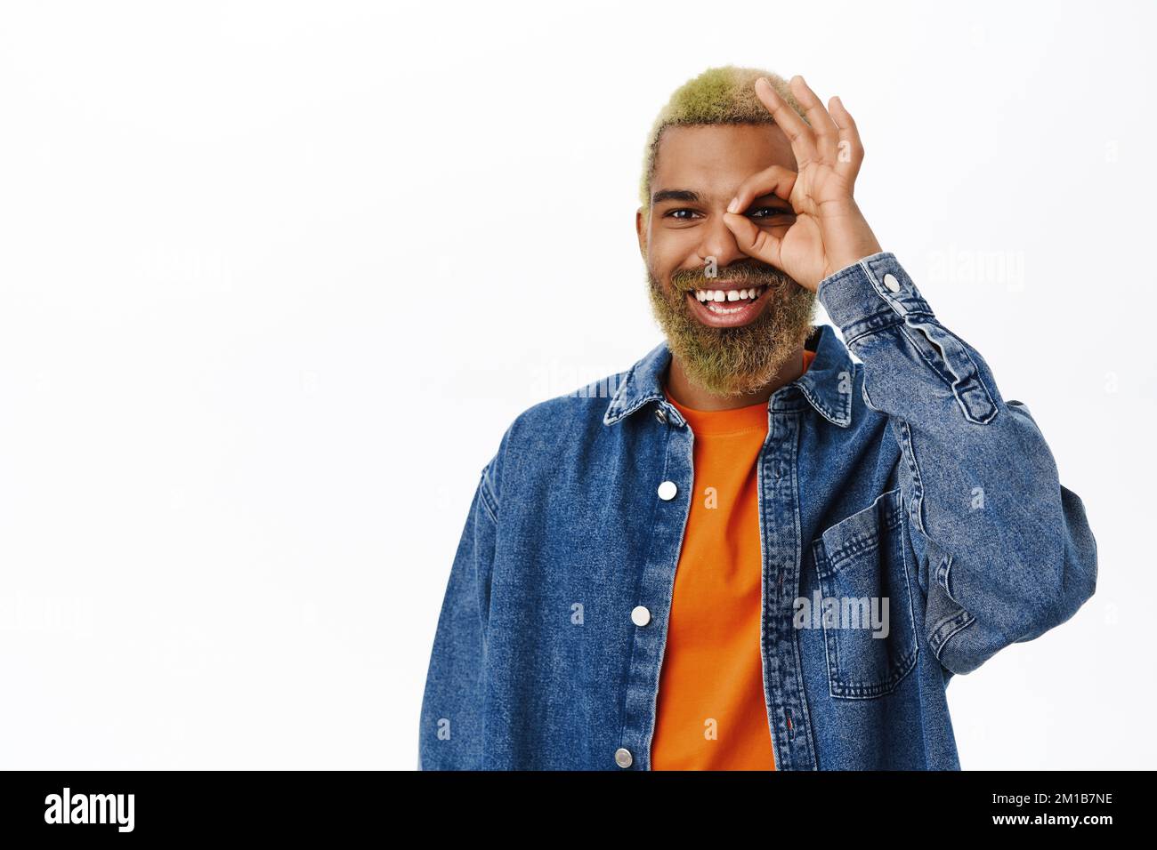 Close up portrait of happy african american guy shows okay, ok sign ...