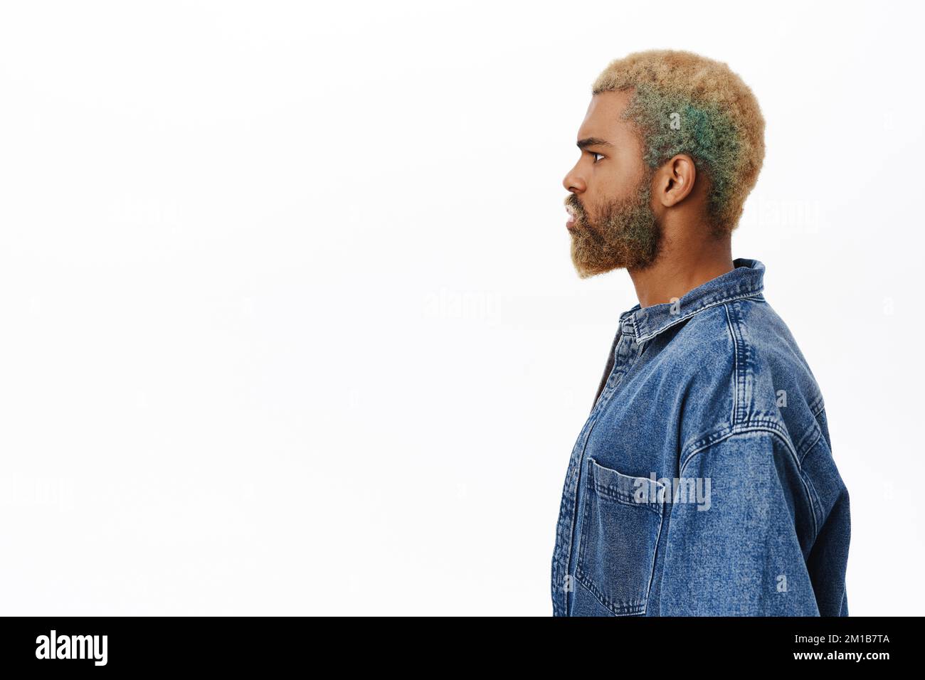Profile portrait of stylish young african american man, has yellow ...