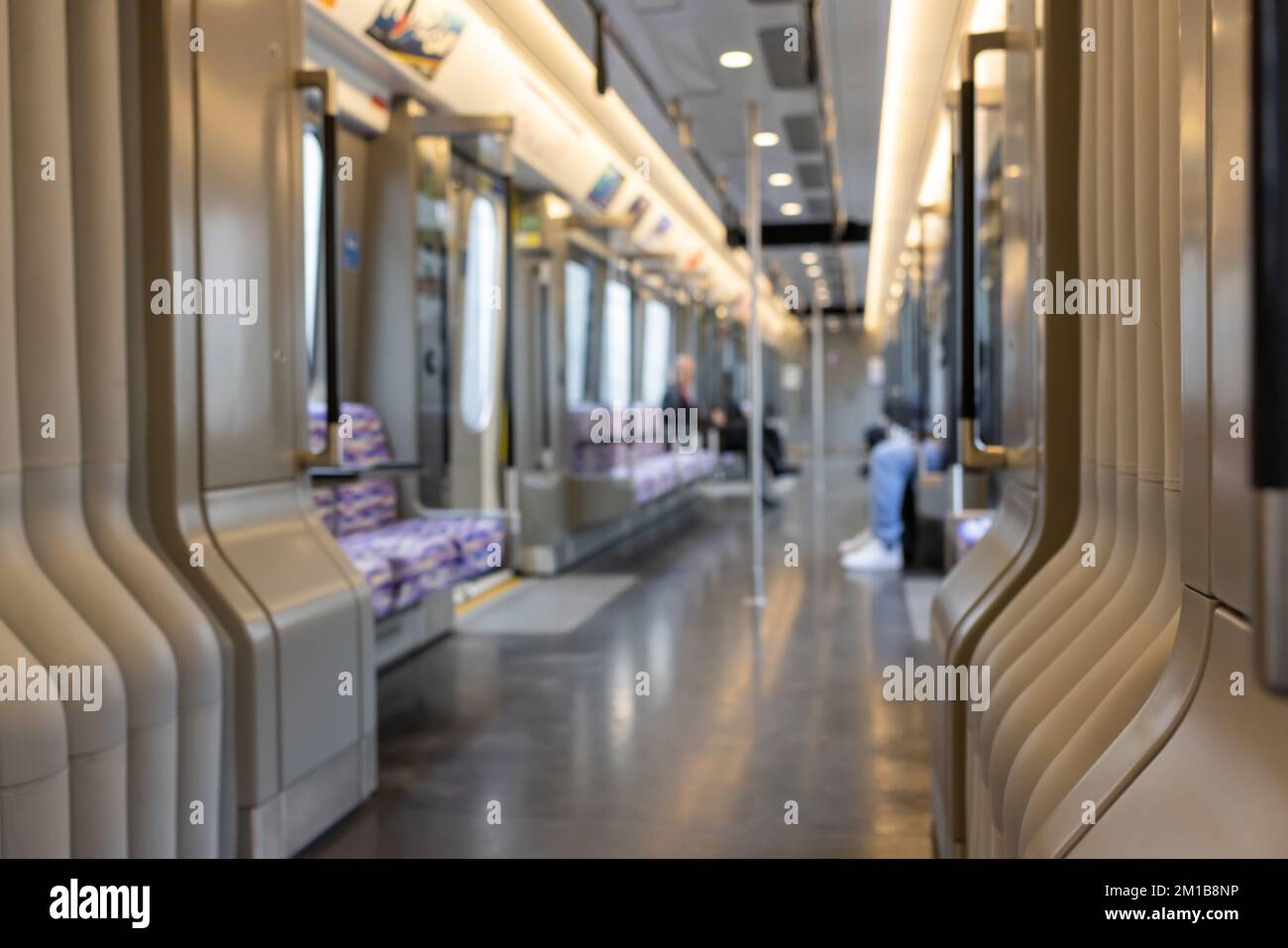 Blurred empty interior of a modern metro train, inside of an ...
