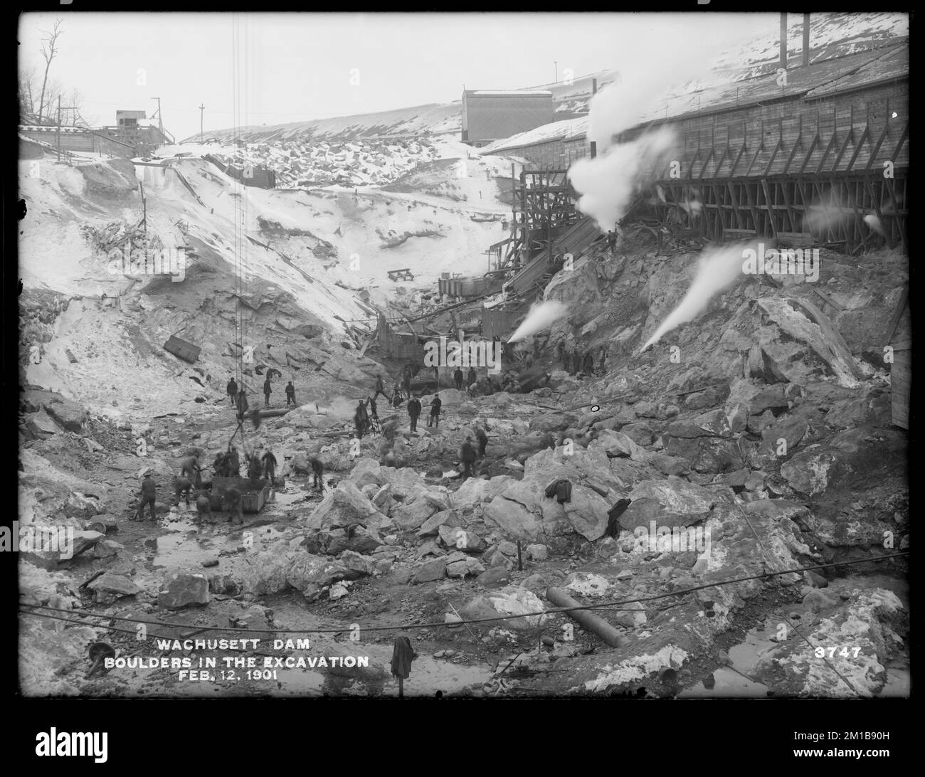 Wachusett Dam, boulders in the excavation, looking upstream, Clinton ...