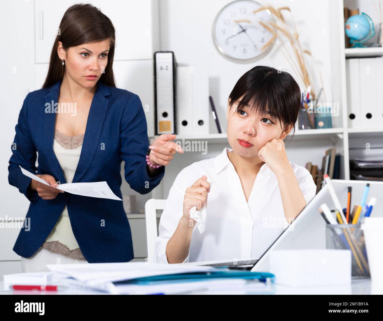 Angry boss screaming to young female manager during working Stock Photo ...