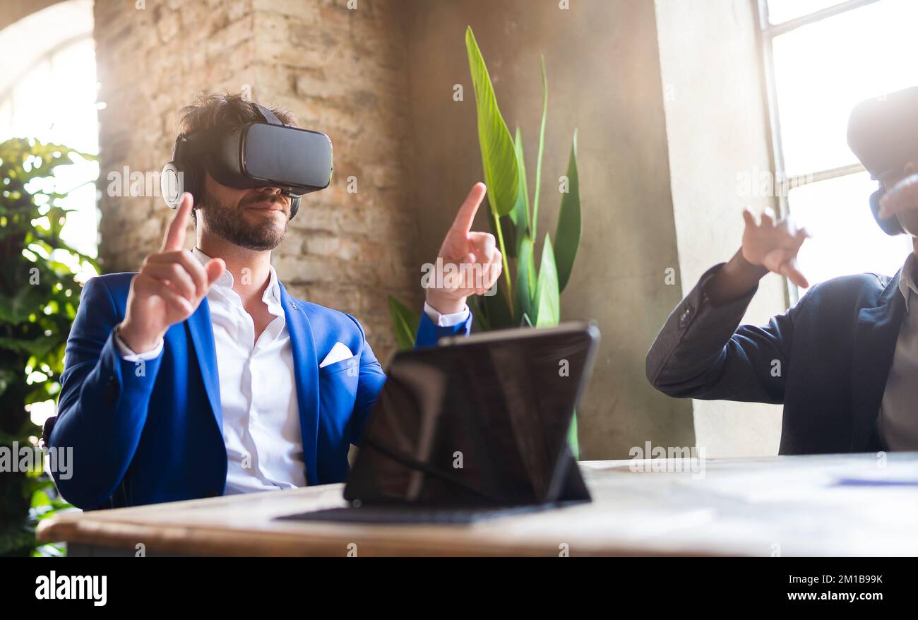 Innovation business team creating a futuristic agency in metaverse. Two ...