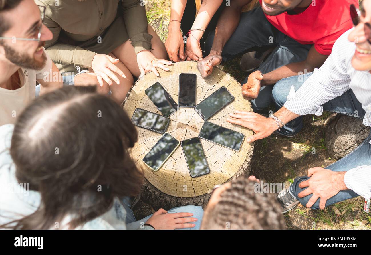 Group of friends switch off smartphones to speaking all together ...