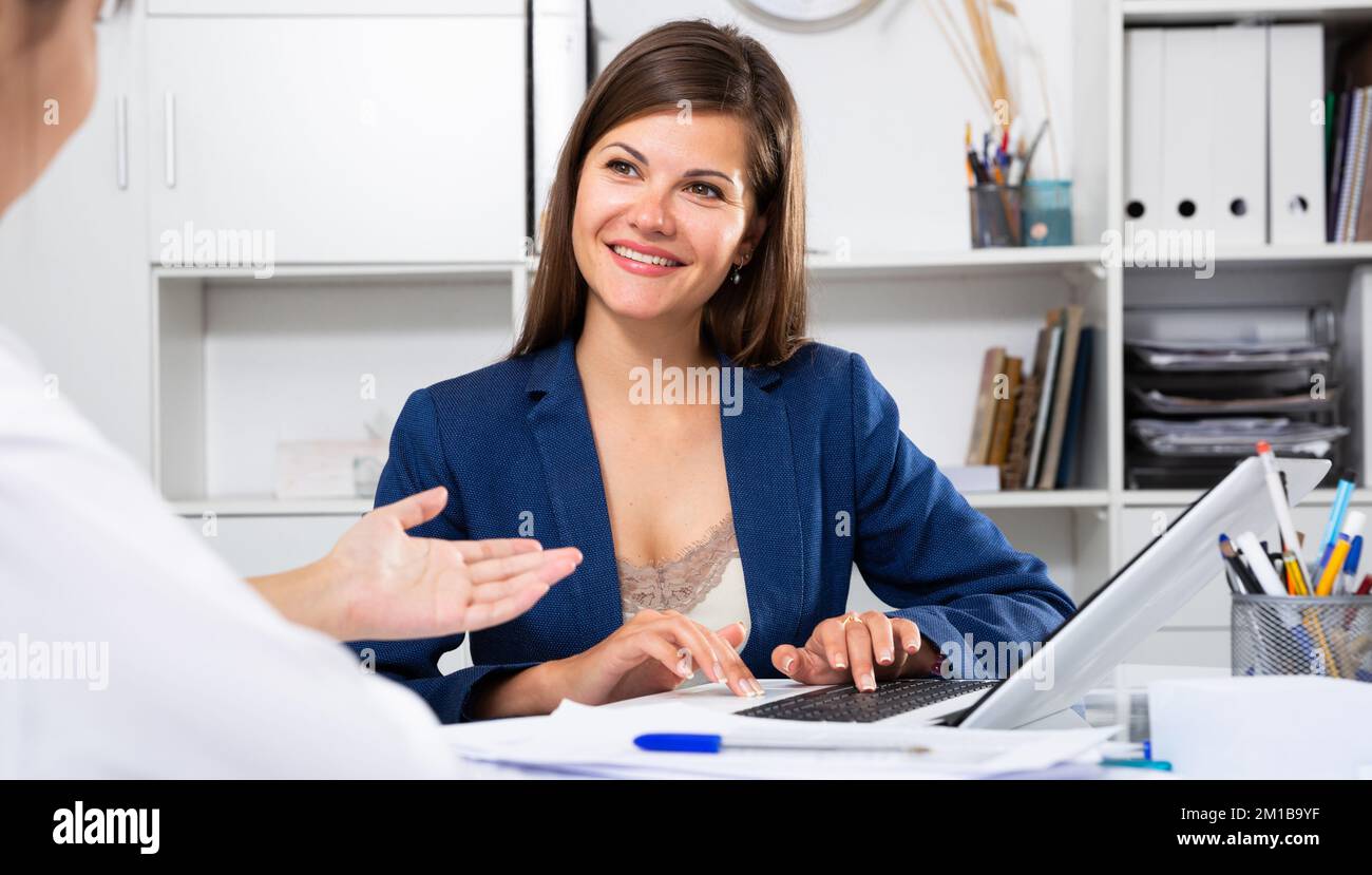 Successful businesswoman communicates with the client in the office ...