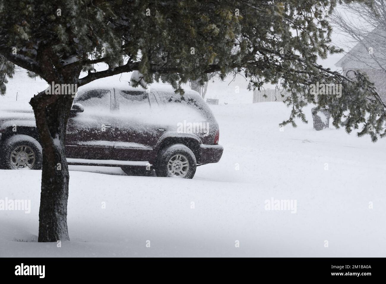 A blizzard in a suburban Chicago neighborhood with blowing and drifting ...