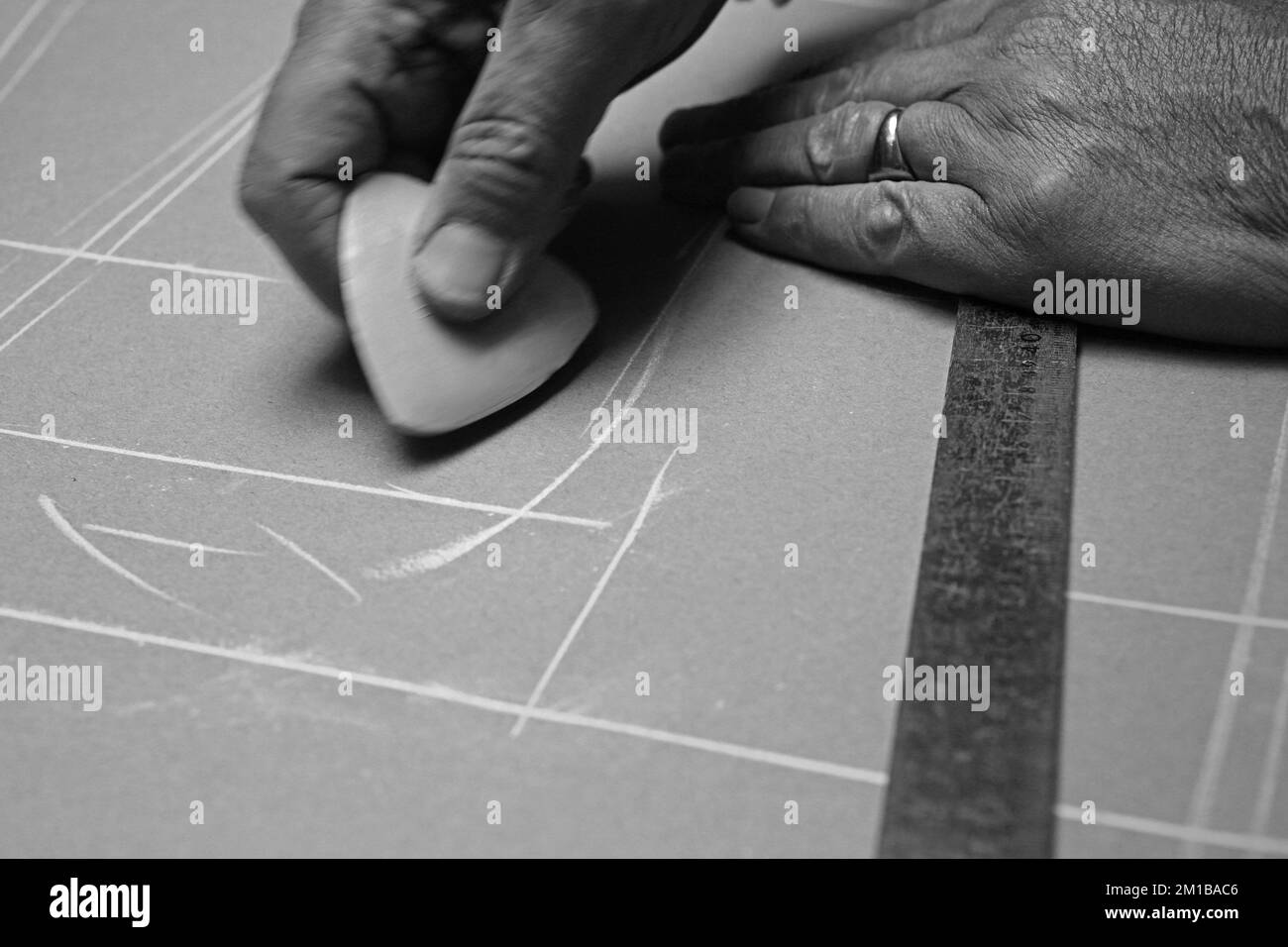 Garment is marked with chalk and ruler at the tailor Anderson ...