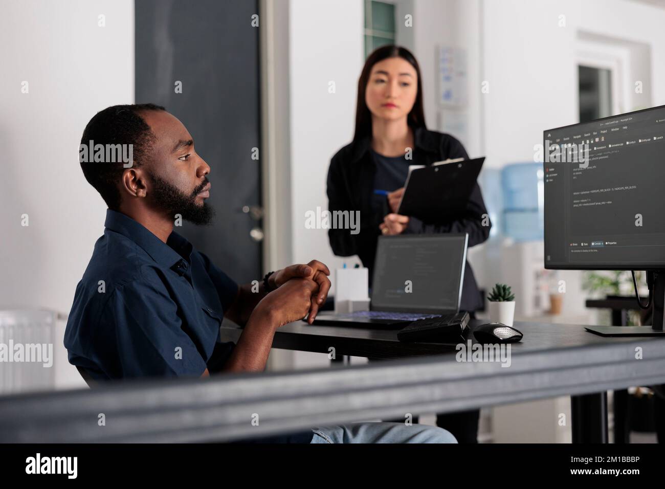 Multi Ethnic System Engineers Collaborating On Programming Project Compiling Algorithm For New