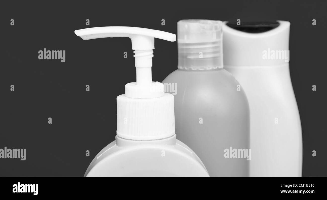 Leakproof Closeup Pump And Flip Cap Bottles Cosmetic Bottles Pink Background Toiletry Packing