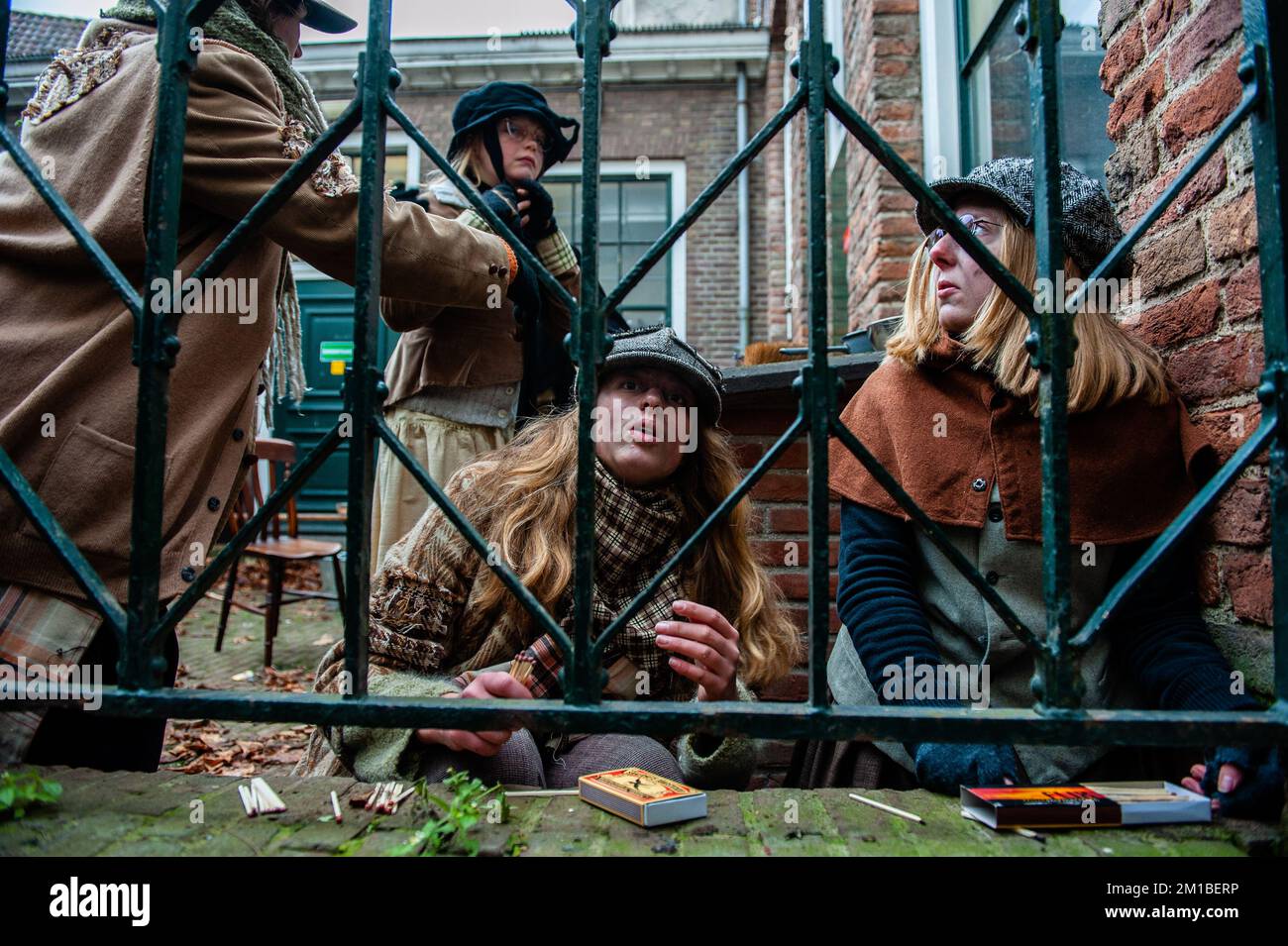 A group of young people seen playing orphans from the Victorian era ...