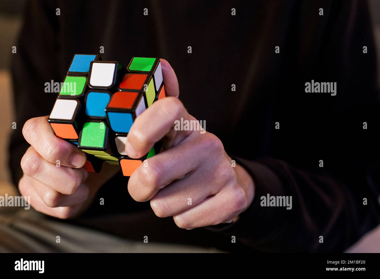 Hands with cube on black background. Concept search strategies Stock ...