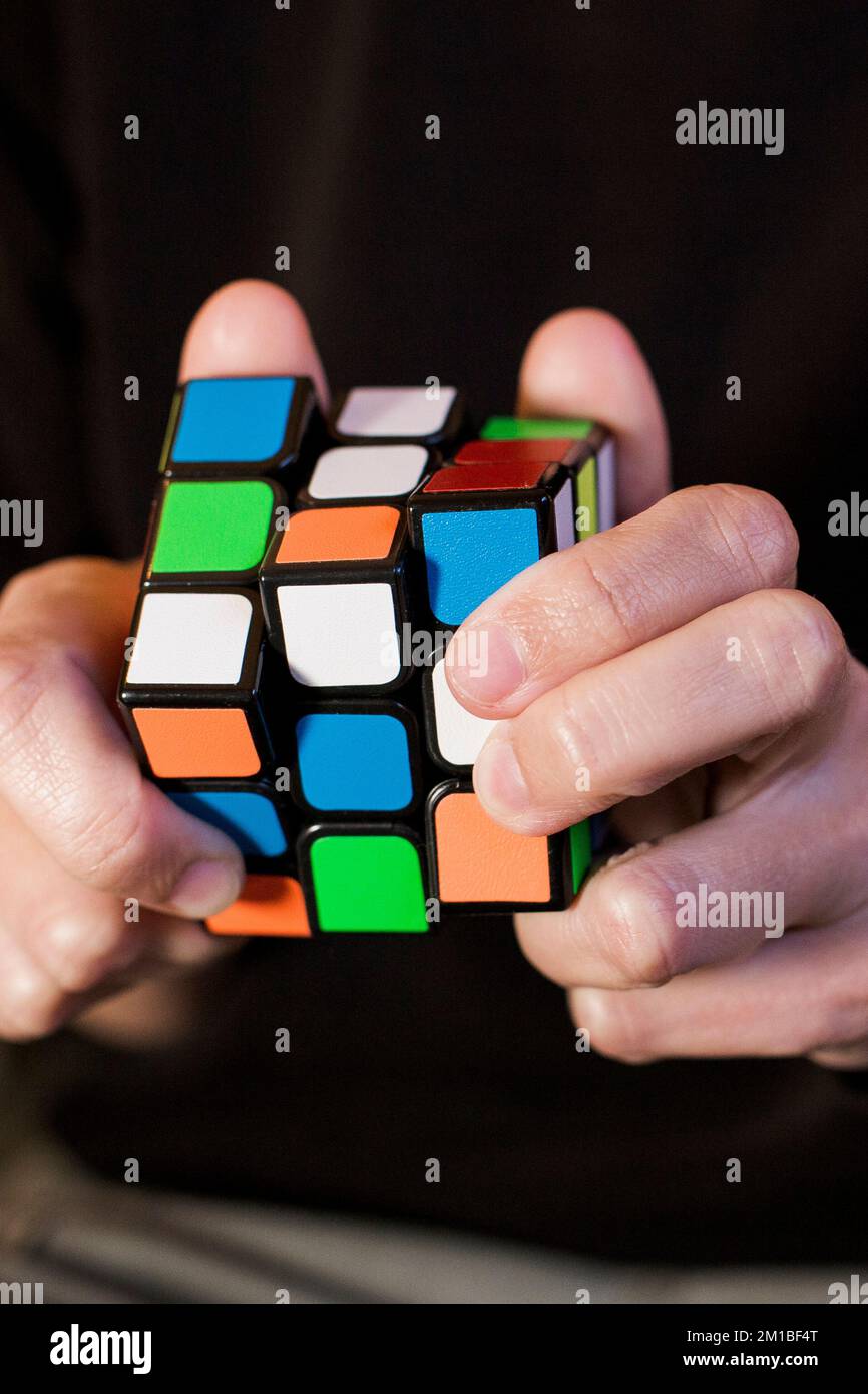 Woman's hand with cube. Rubik. Concept of strategies Stock Photo - Alamy