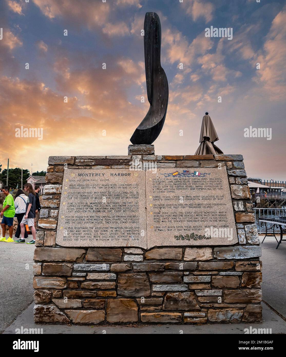 Pelican sculpture on top of stone monument with history of Monterey Bay ...