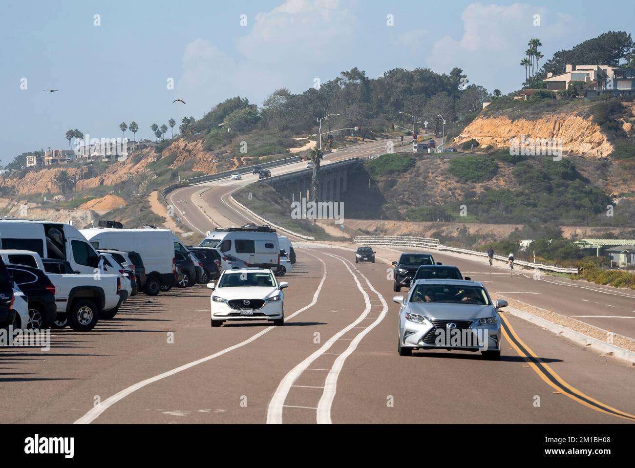 Cars on highway with mountain in the background during sunny day Stock ...