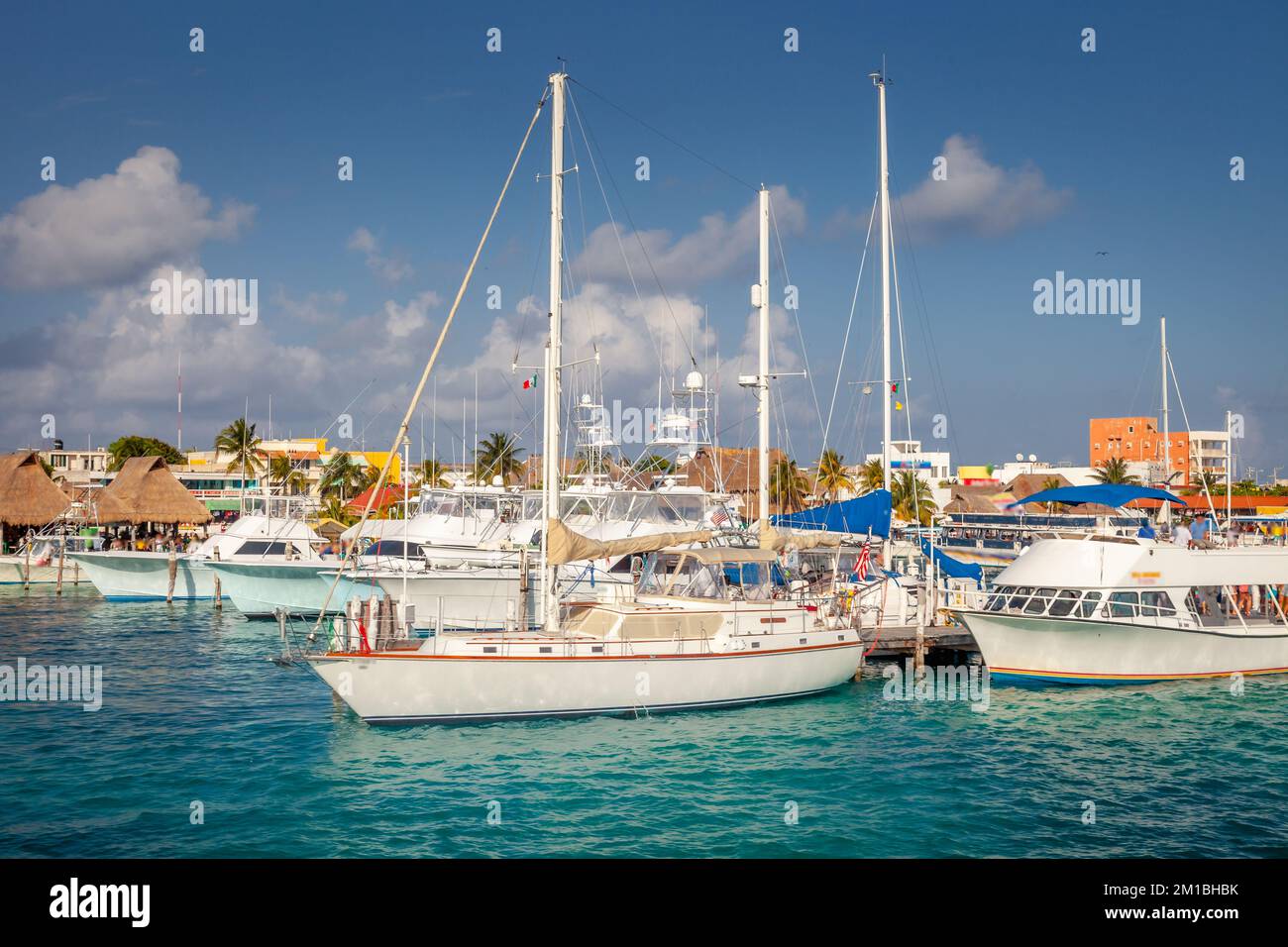 Cancun marina with sailboats, caribbean bach at sunset, Riviera Maya ...