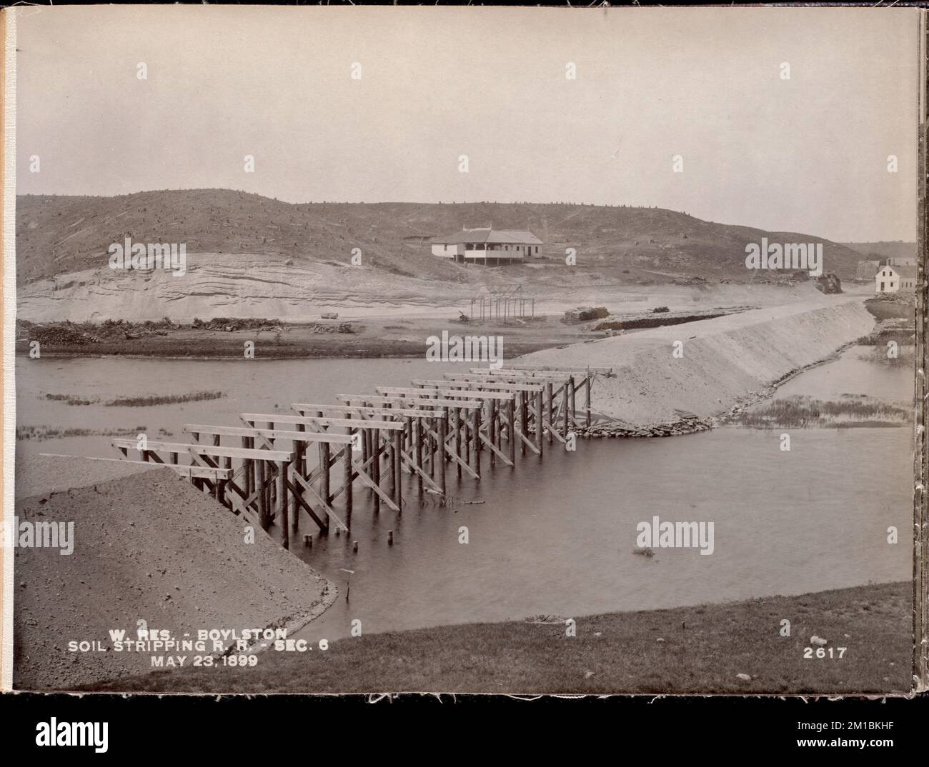 Wachusett Reservoir, pile trestle and embankment of soil stripping ...