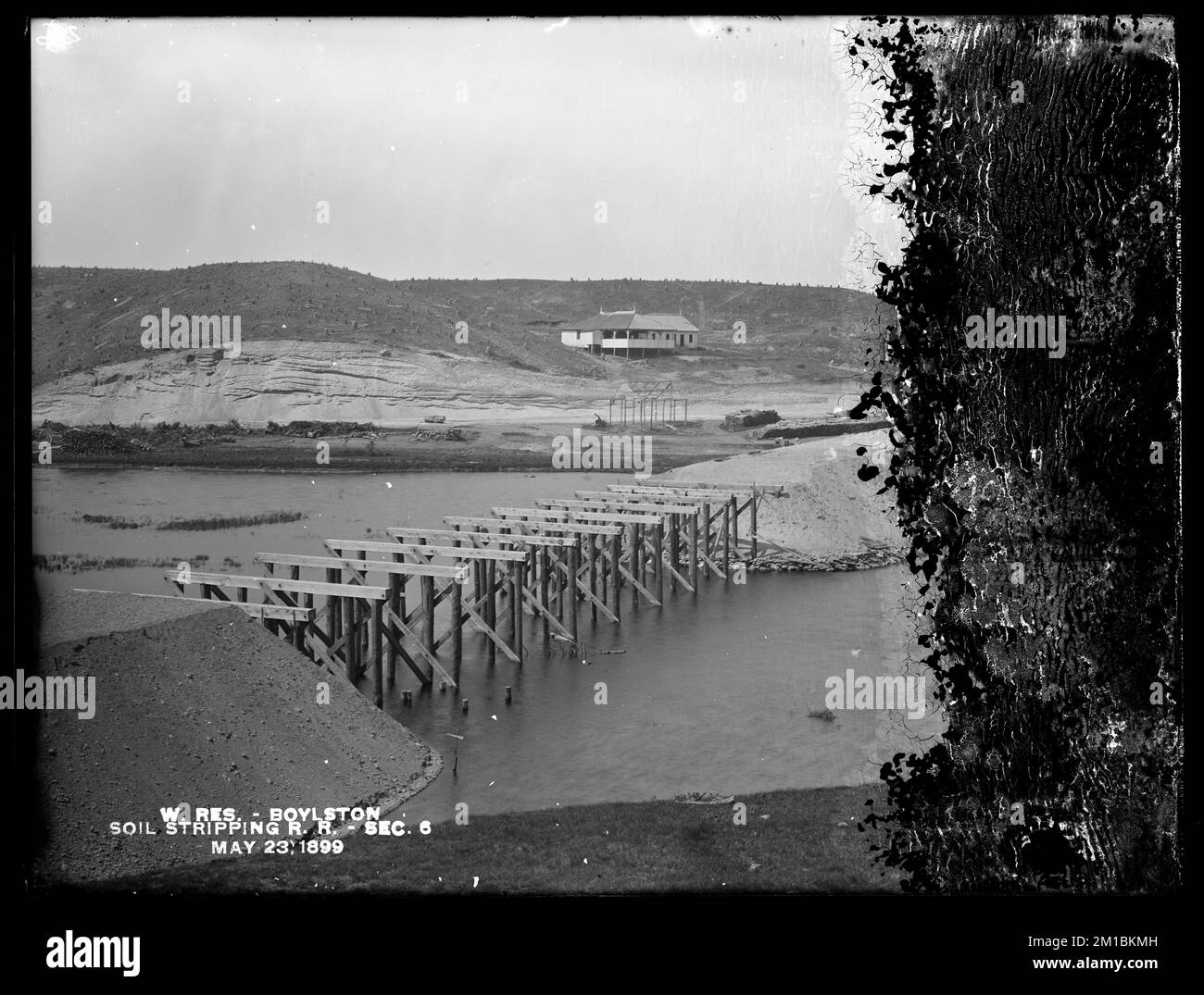 Wachusett Reservoir, pile trestle and embankment of soil stripping ...