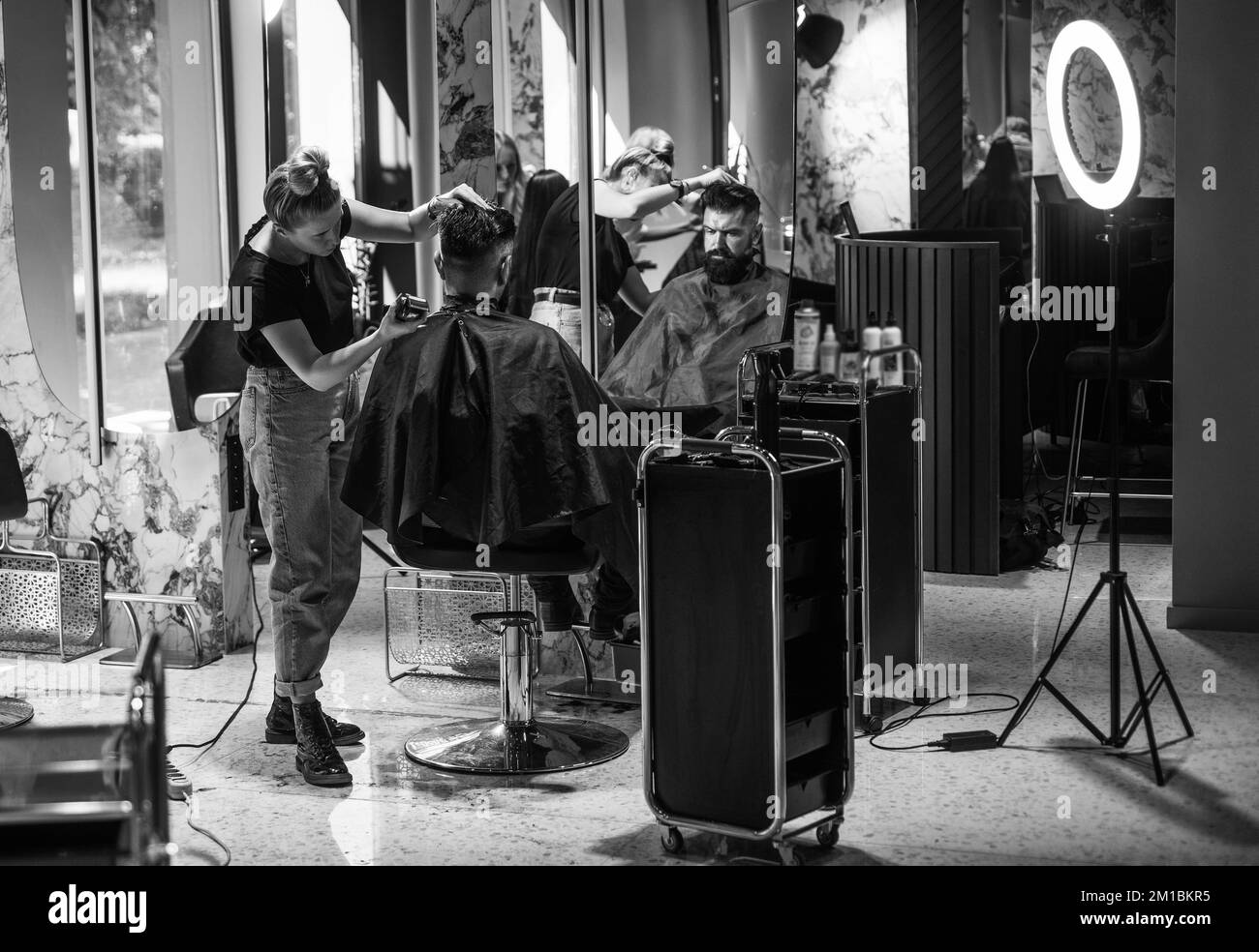 Morning routine. brutal hipster with moustache making new hairstyle ...