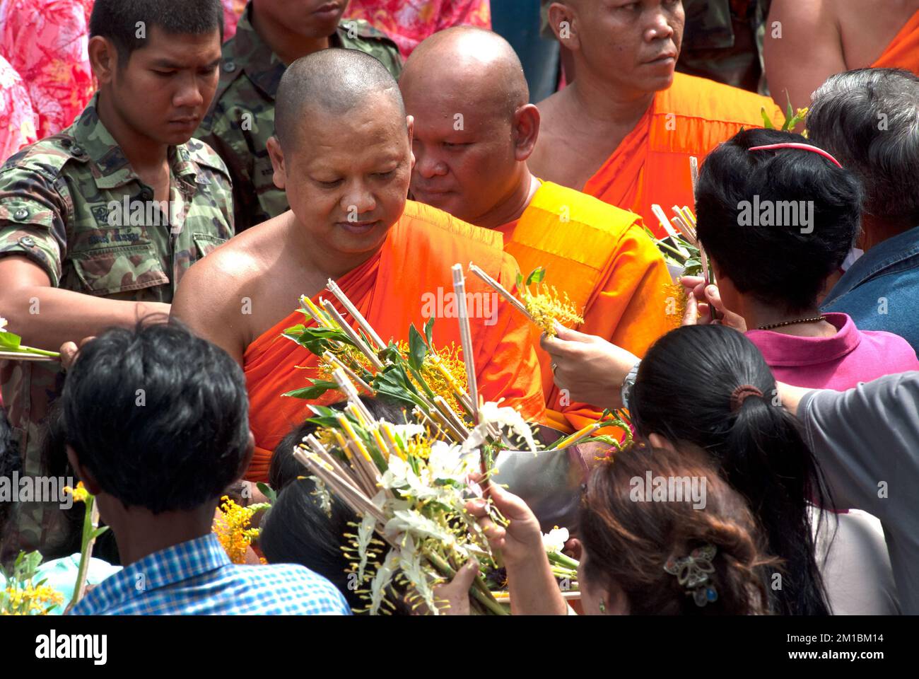 Many Thai people Give Flowers to Buddhist Monks for alms in The Tak Bat ...