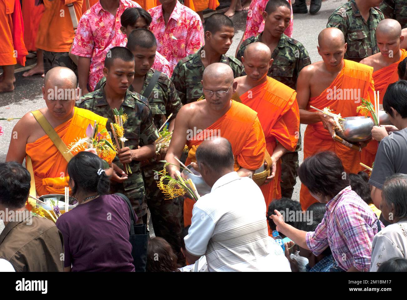 Many Thai people Give Flowers to Buddhist Monks for alms in The Tak Bat ...