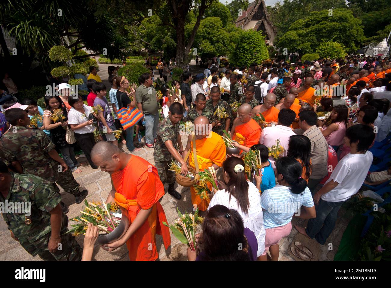 Many Thai people Give Flowers to Buddhist Monks for alms in The Tak Bat ...