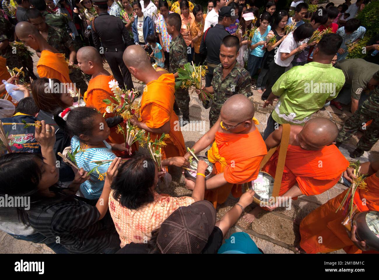 Many Thai people Give Flowers to Buddhist Monks for alms in The Tak Bat ...