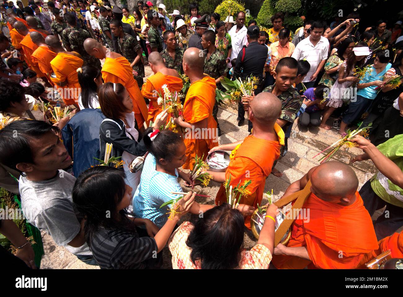 Many Thai people Give Flowers to Buddhist Monks for alms in The Tak Bat ...