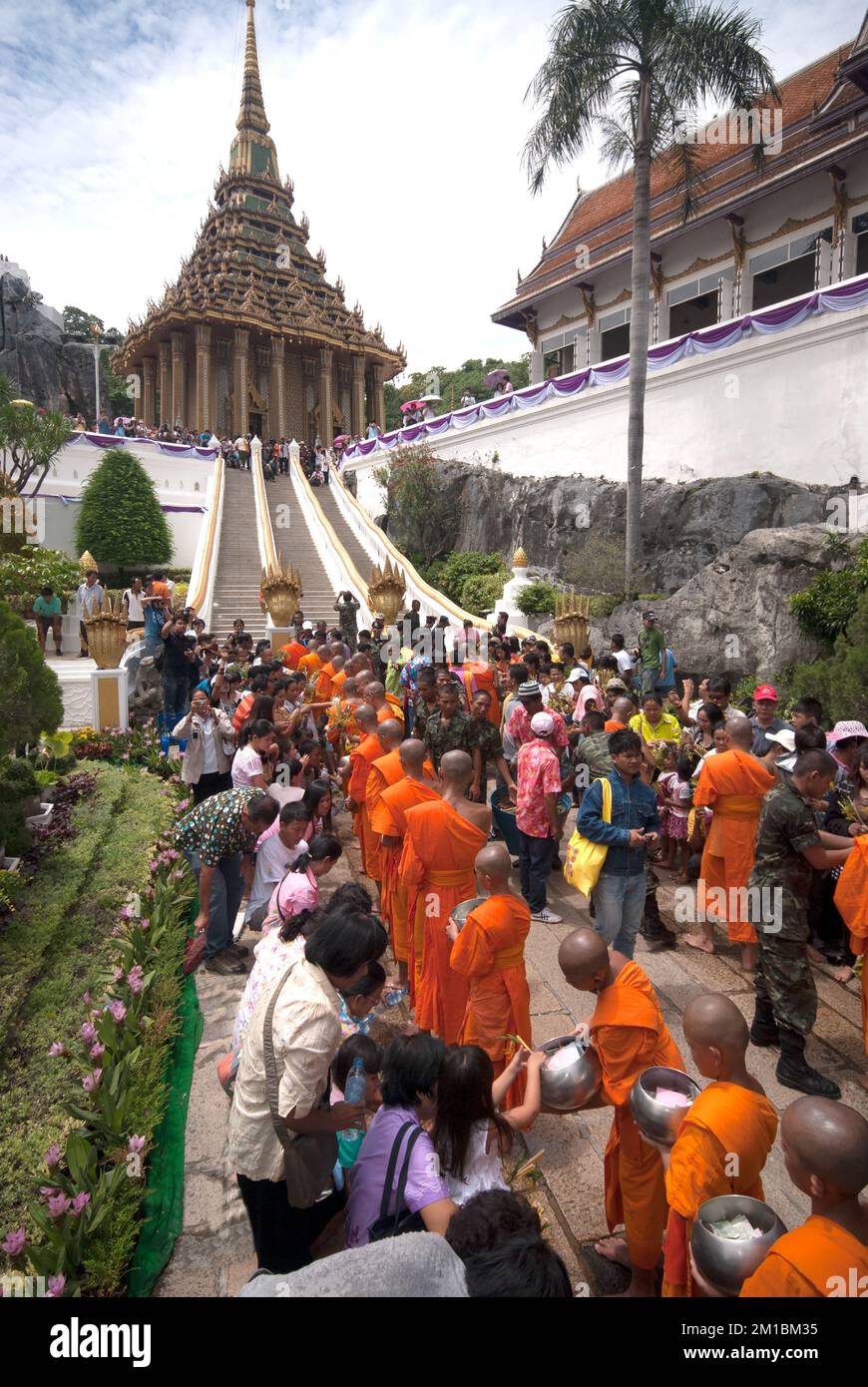 Many Thai people Give Flowers to Buddhist Monks for alms in The Tak Bat ...