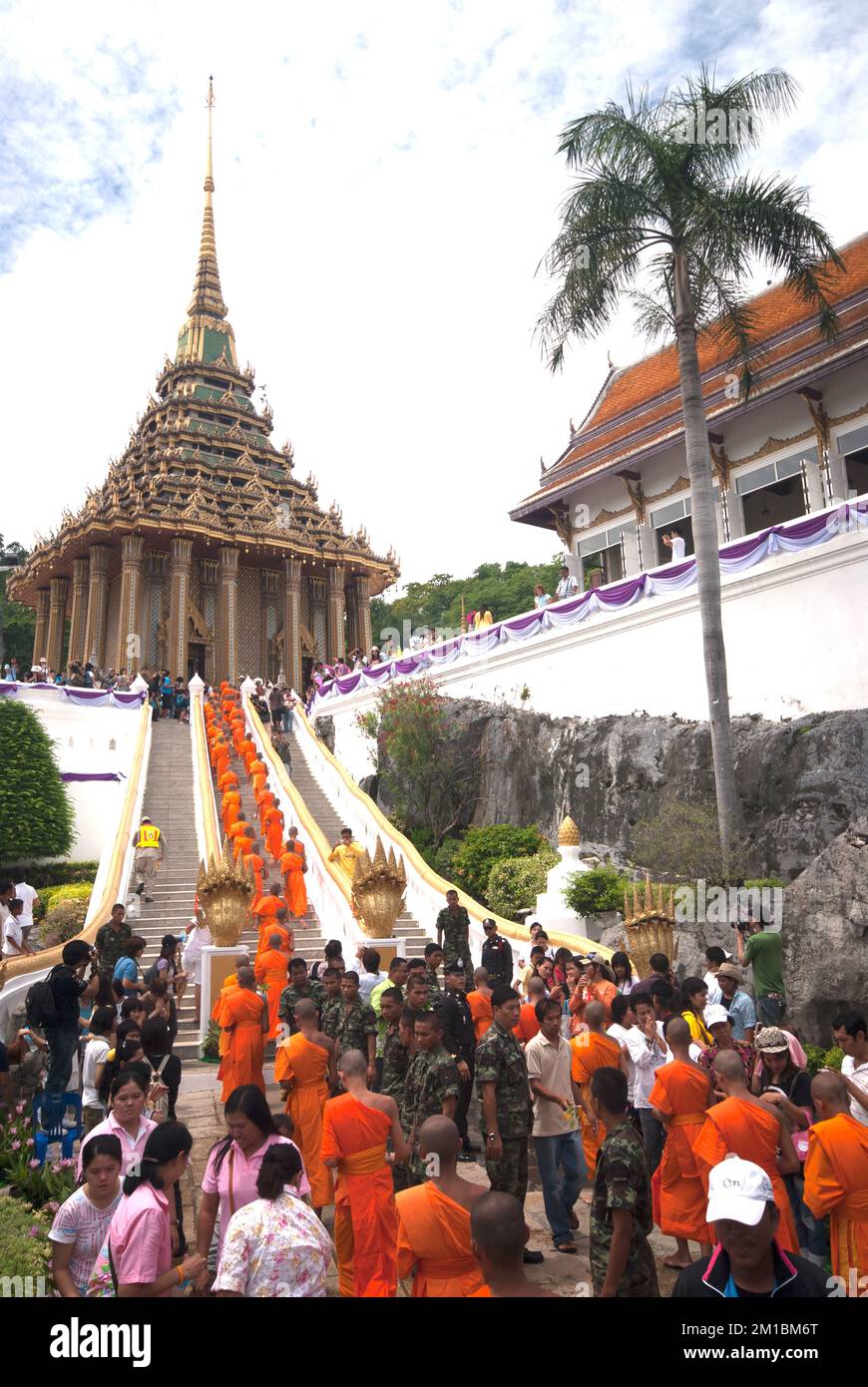 Many Thai people Give Flowers to Buddhist Monks for alms in The Tak Bat ...