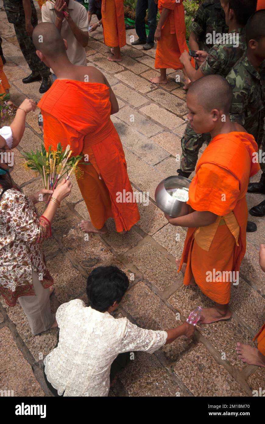 Many Thai people Give Flowers to Buddhist Monks for alms in The Tak Bat ...
