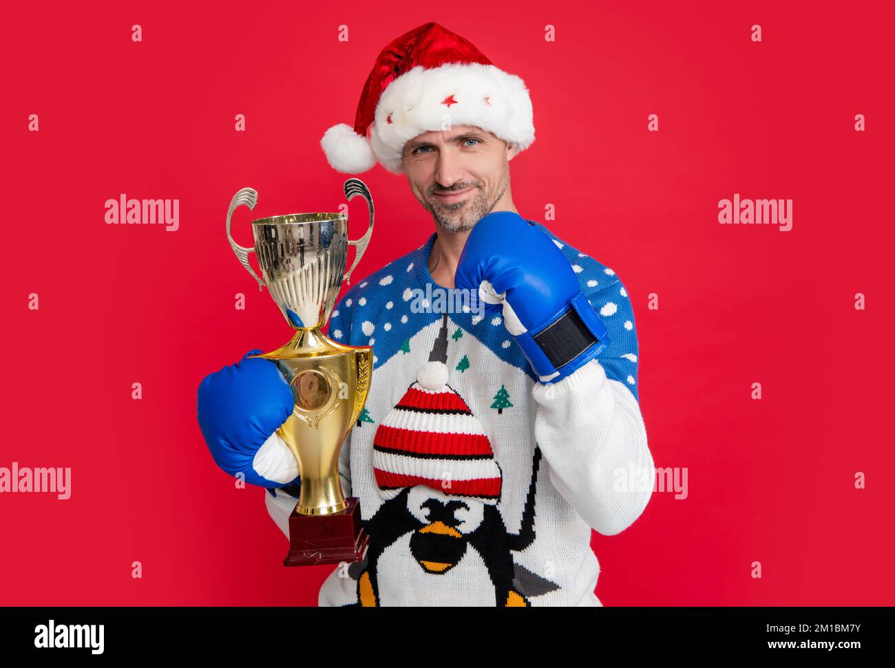 xmas man boxer celebrating victory in studio. man celebrating xmas ...