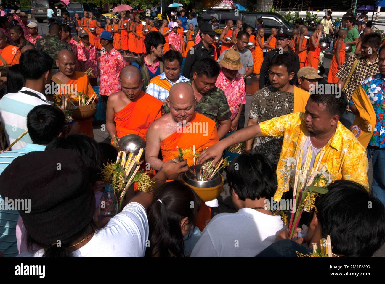 Many Thai people Give Flowers to Buddhist Monks for alms in The Tak Bat ...