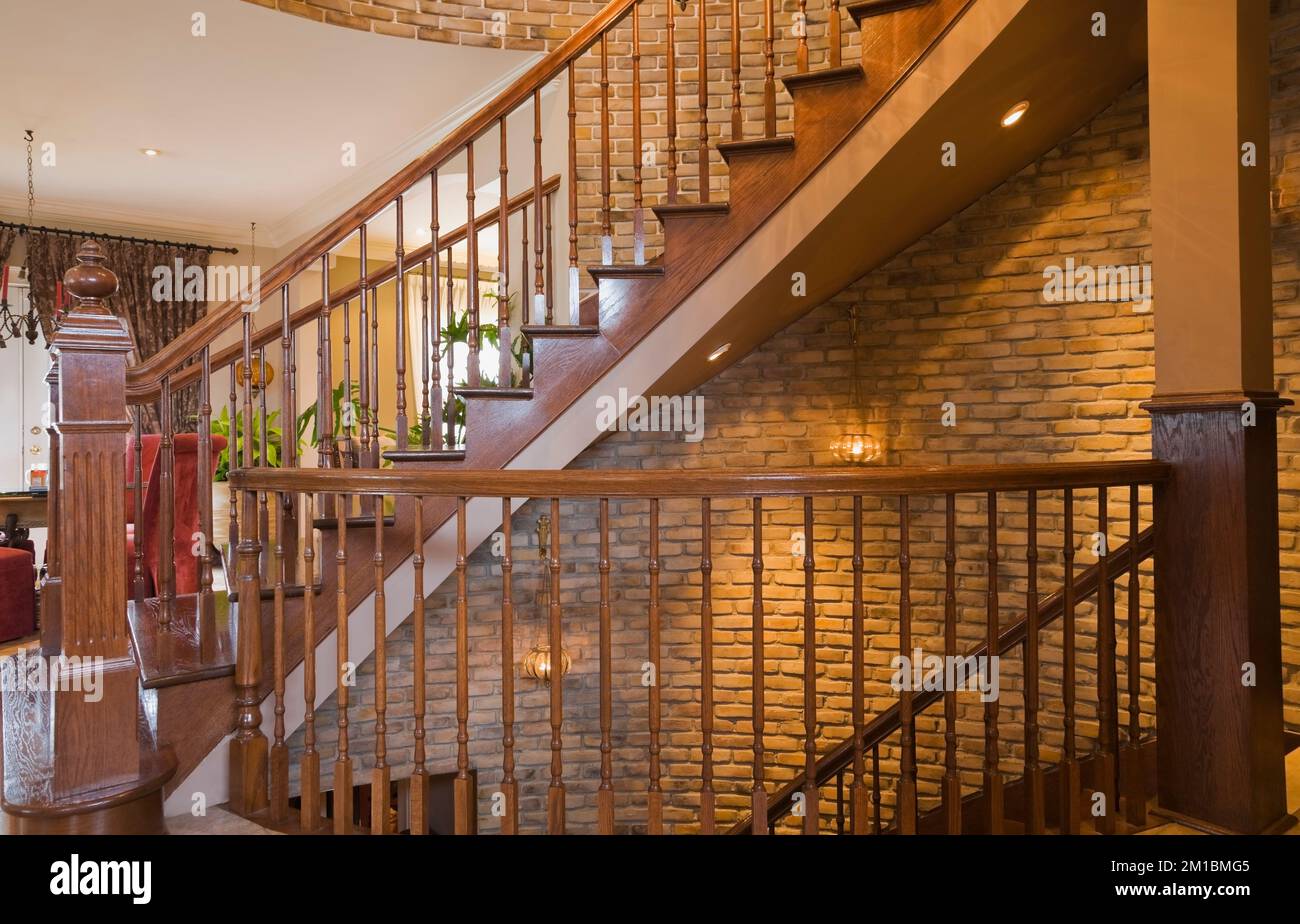Main wooden twisting staircase with carved newel posts inside luxurious ...
