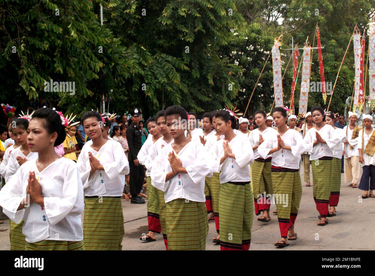 Many pretty woman on traditional dance in Tak Bat Dok Mai Festival is ...