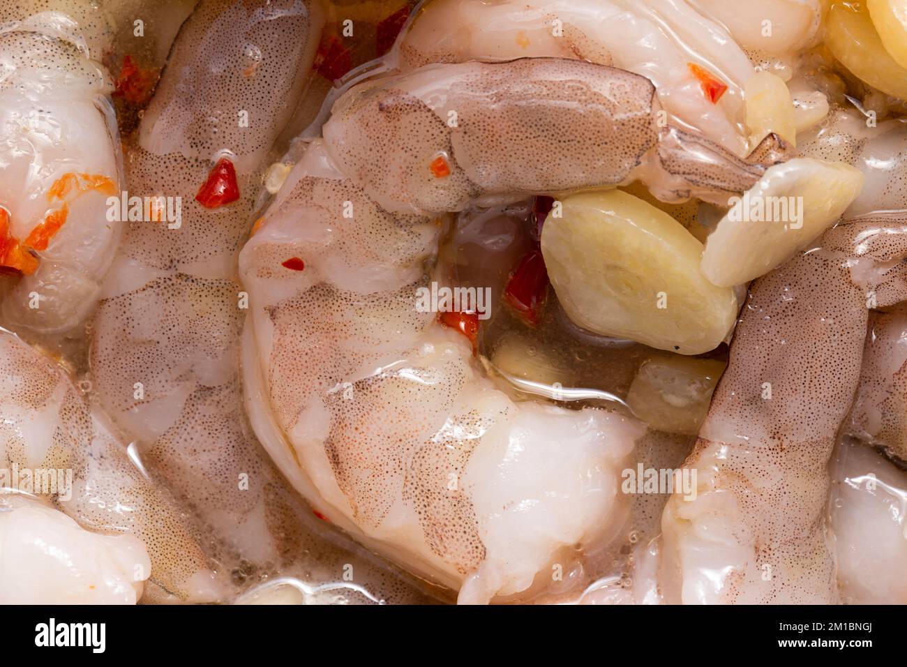 The texture of raw shrimps as a background. A close shot of raw shrimps ...