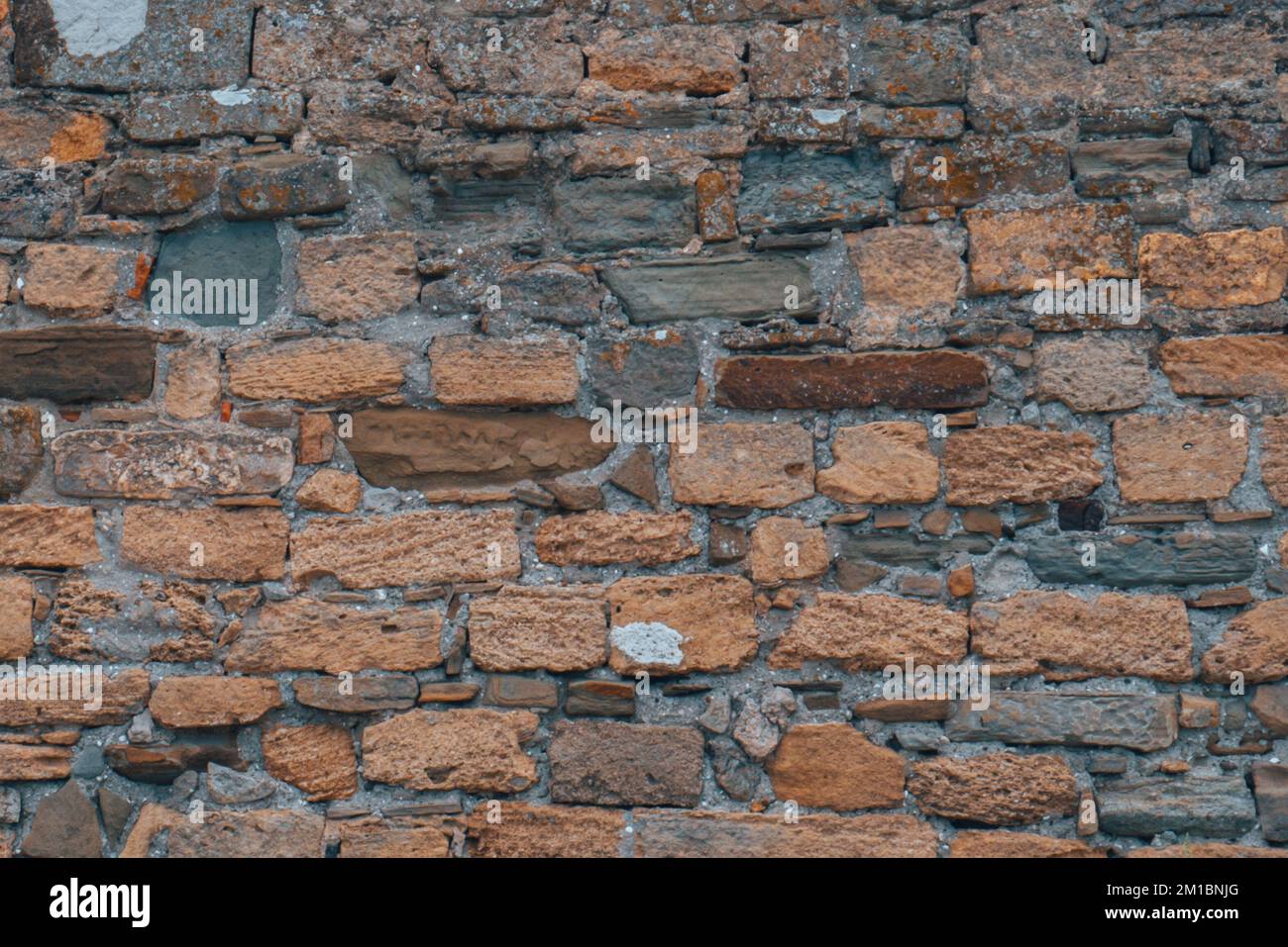 Ancient broken sandstone wall and ble sky Stock Photo - Alamy