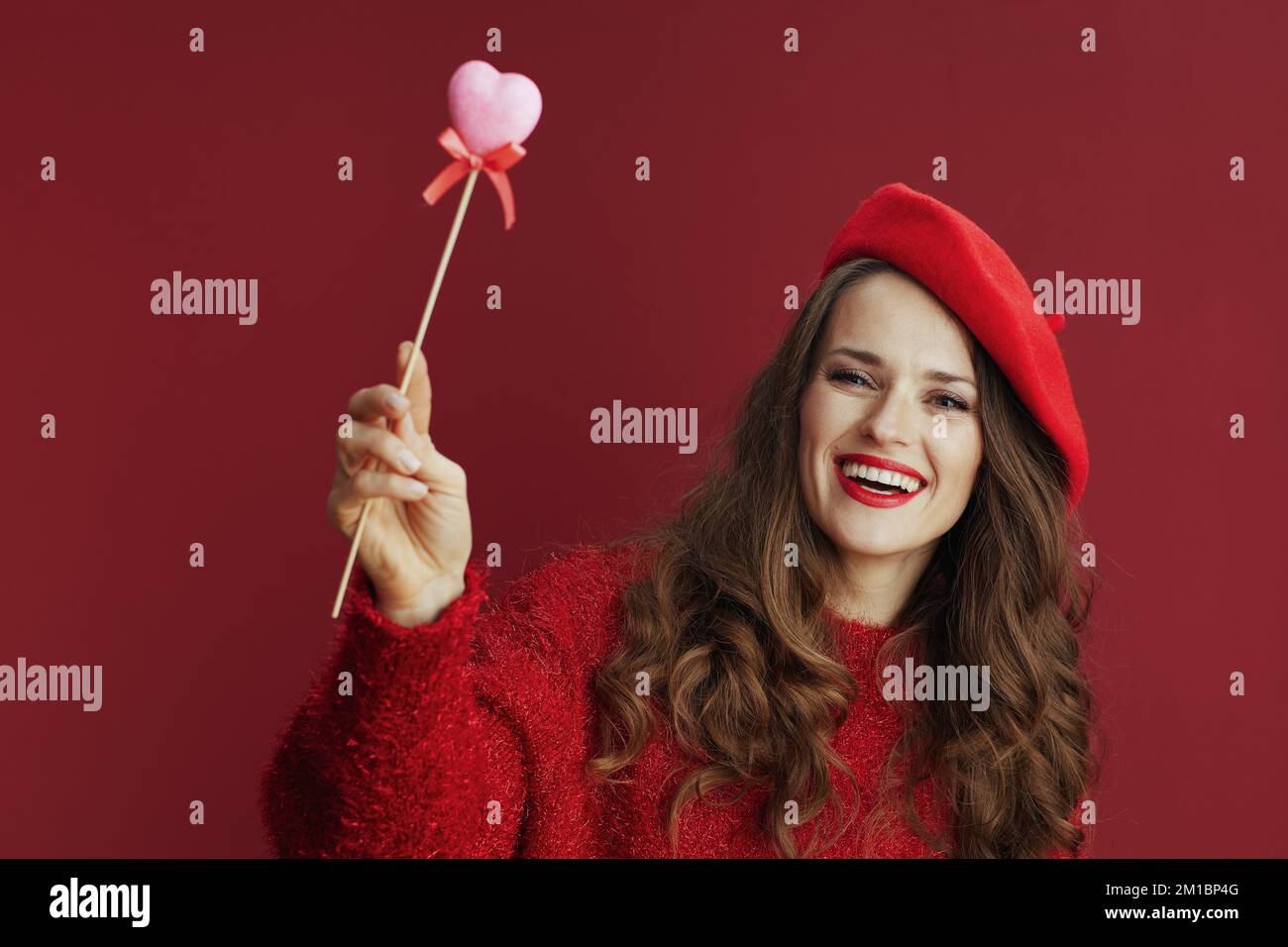 Happy Valentine. happy stylish woman in red sweater and beret with ...